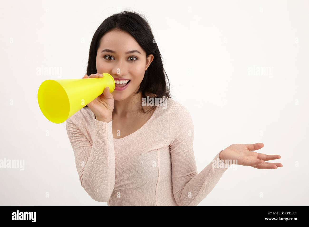 malay woman using megaphone on the white background Stock Photo - Alamy