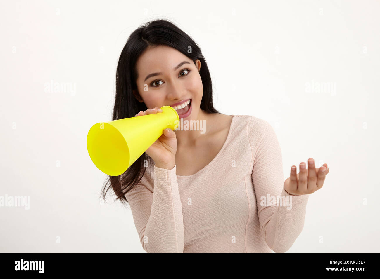 malay woman using megaphone on the white background Stock Photo - Alamy
