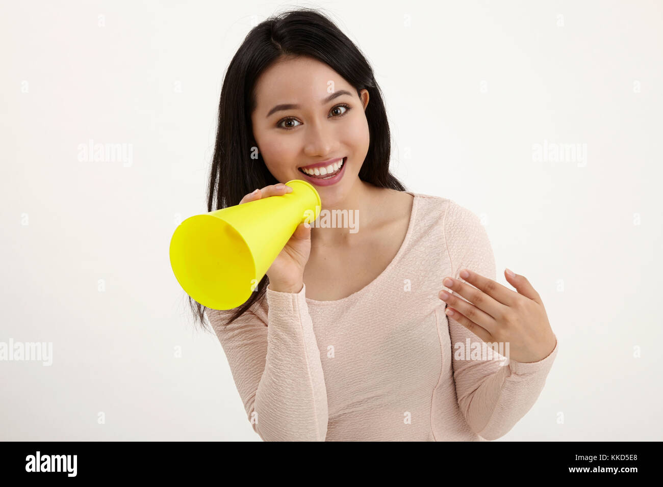 malay woman using megaphone on the white background Stock Photo - Alamy
