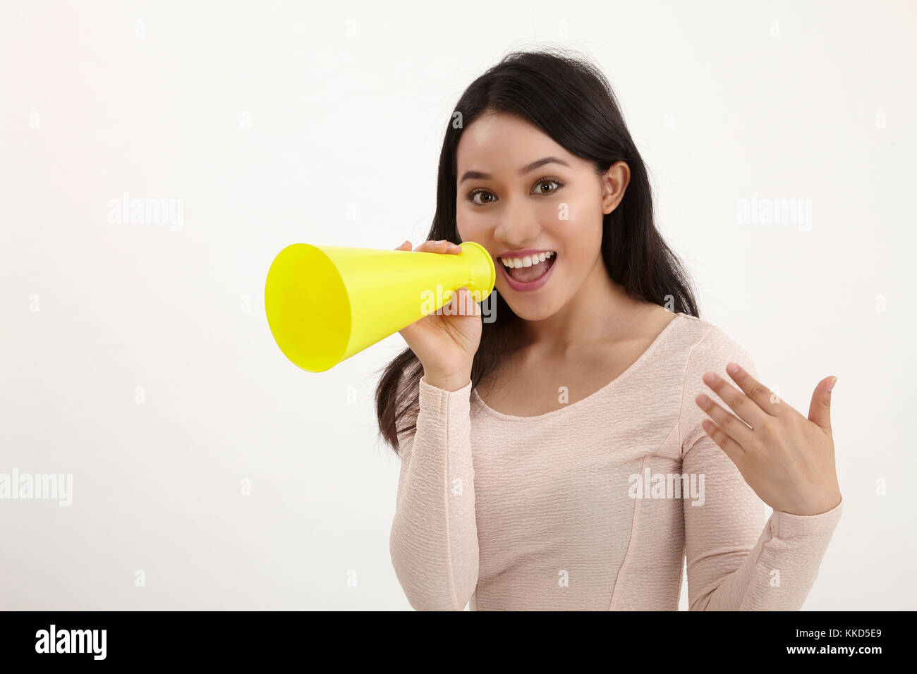malay woman using megaphone on the white background Stock Photo - Alamy