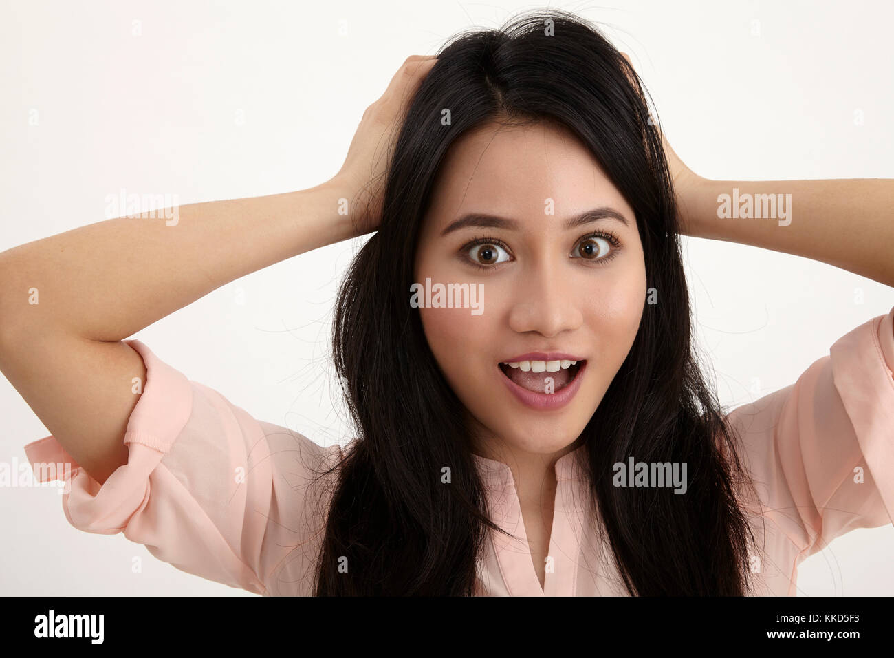 woman surprise with hand rest on head Stock Photo - Alamy