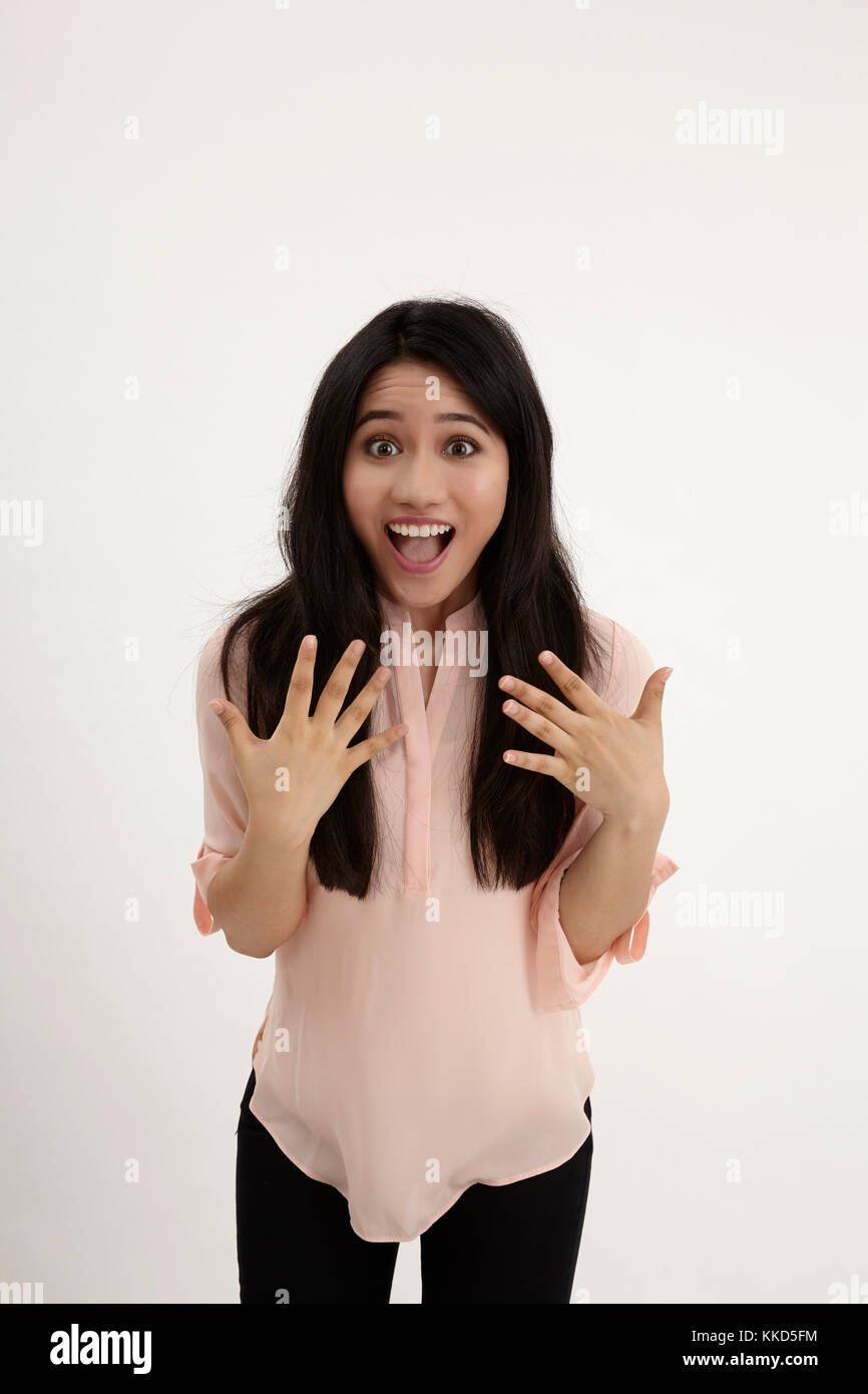 malaay woman with surprised expression on the white background Stock ...