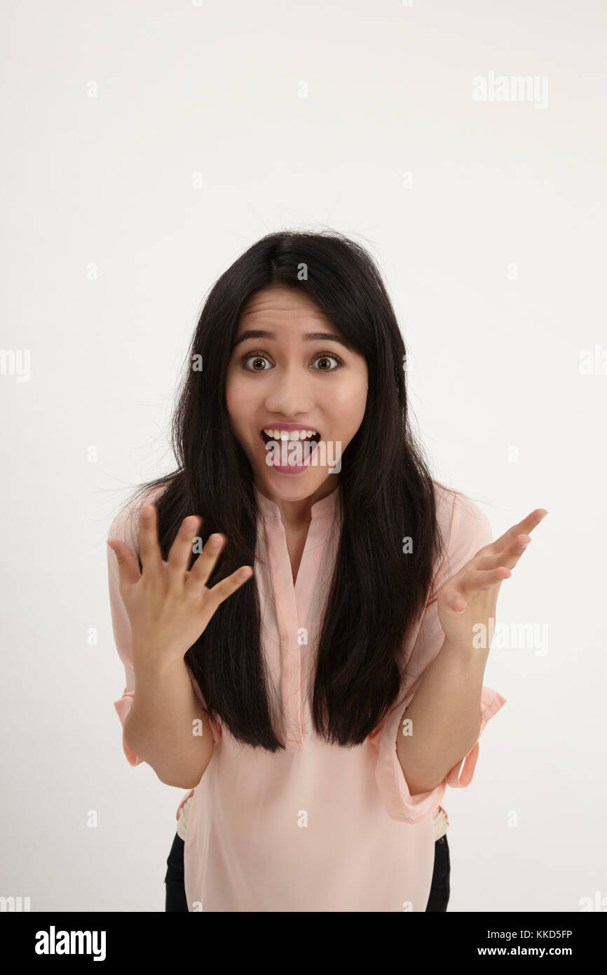malaay woman with surprised expression on the white background Stock ...