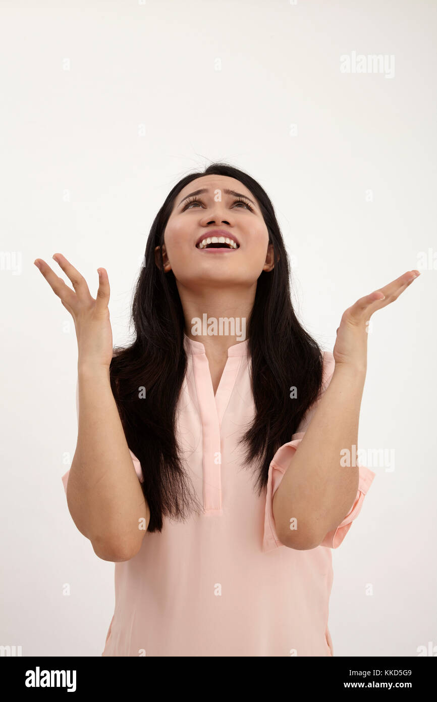 malaay woman with surprised expression on the white background Stock ...