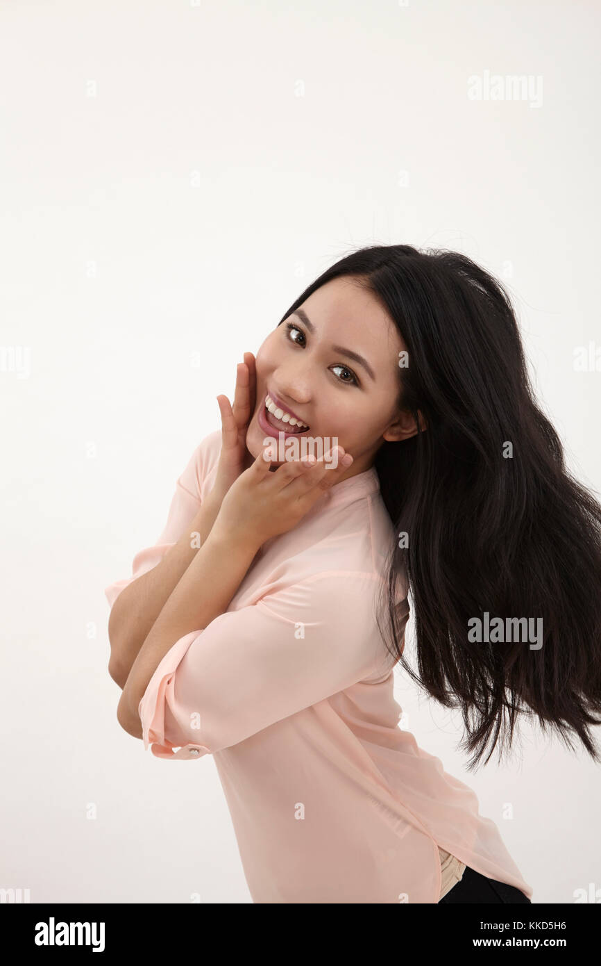 Asian girl hand on chin hi-res stock photography and images - Alamy