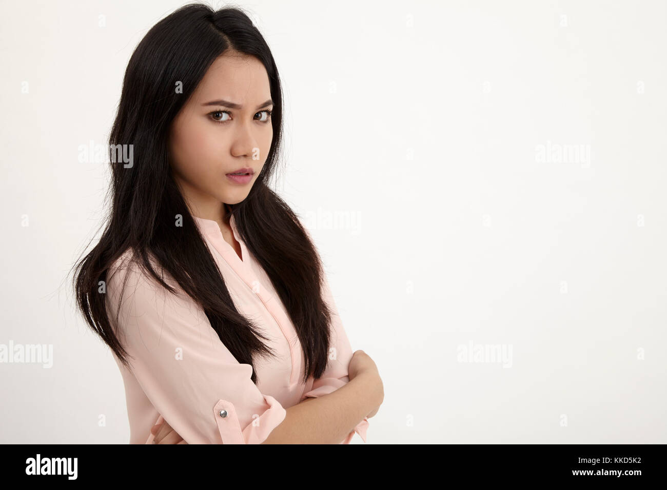 side view of a angry malay woman Stock Photo - Alamy