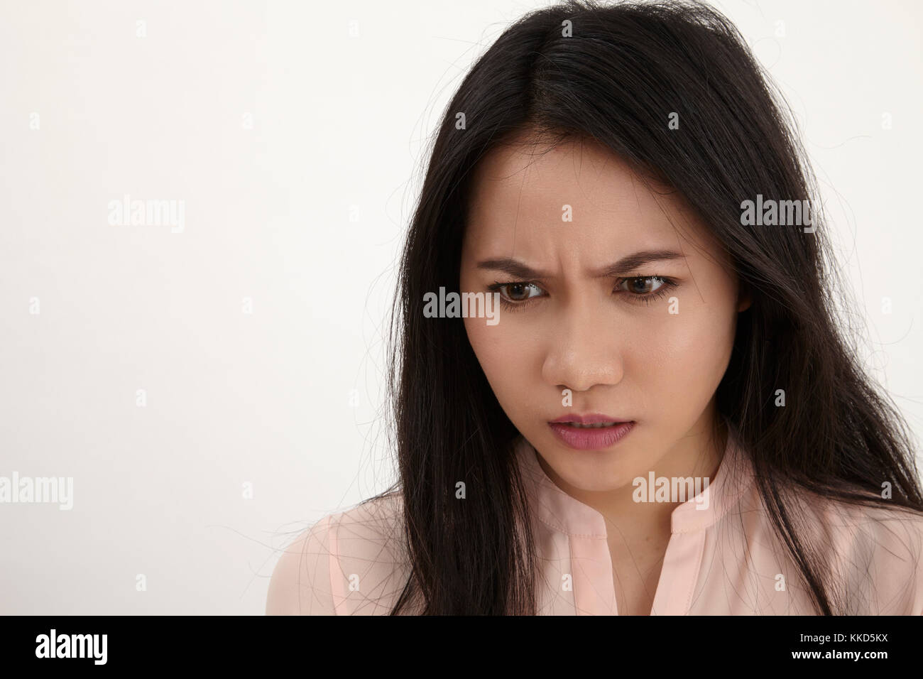 angry malay woman on the white background Stock Photo - Alamy