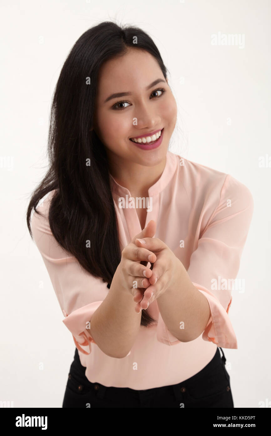 malay woman raising arm about to do hand shake Stock Photo - Alamy