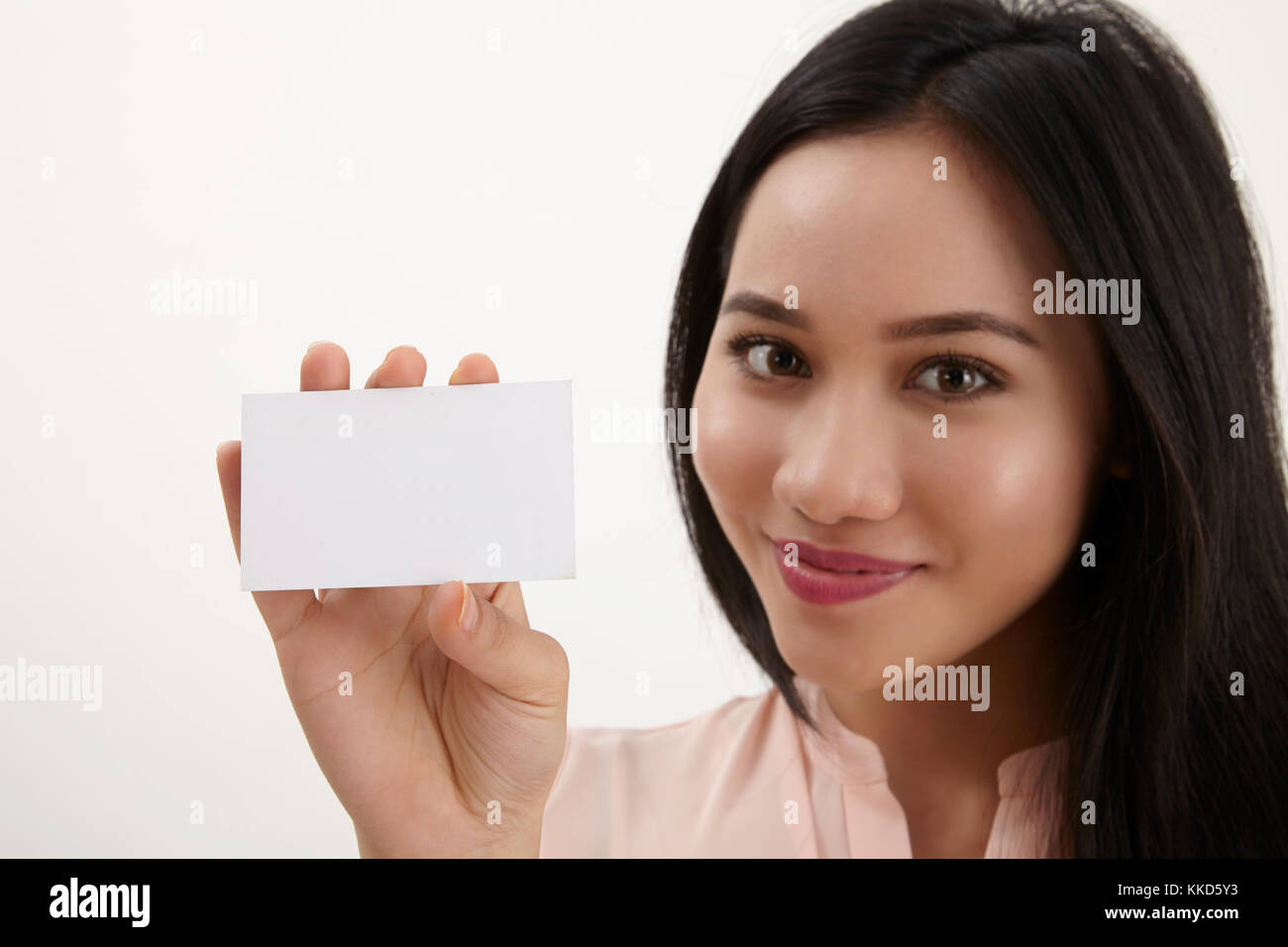 woman showing empty blank paper card sign with copy space for text ...