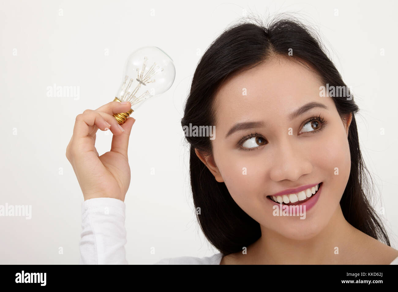 malay woman holding light bulb Stock Photo - Alamy