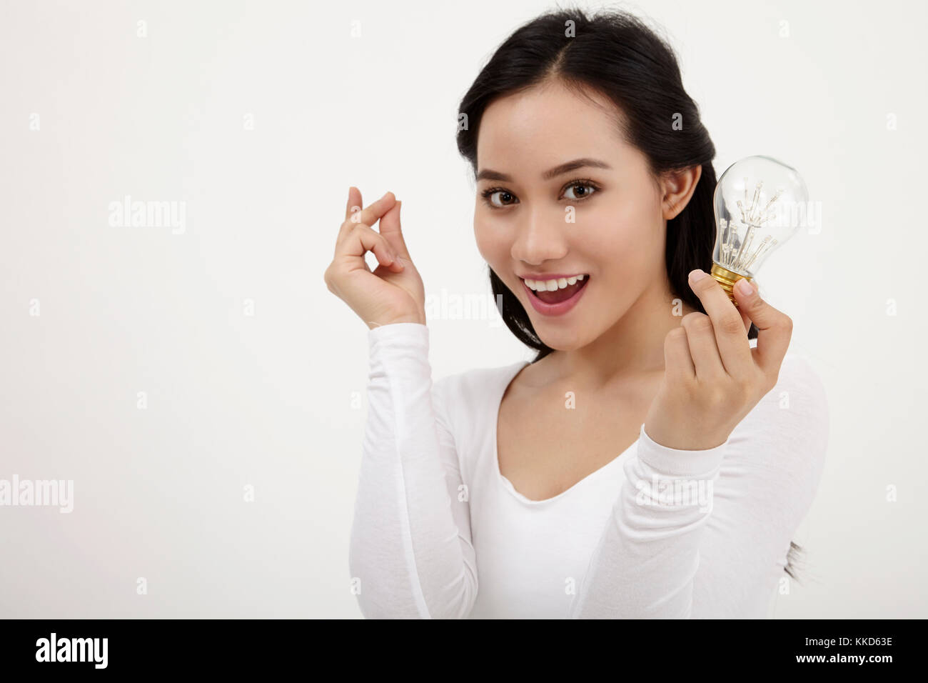 Woman light bulb holding bright hi-res stock photography and images - Alamy