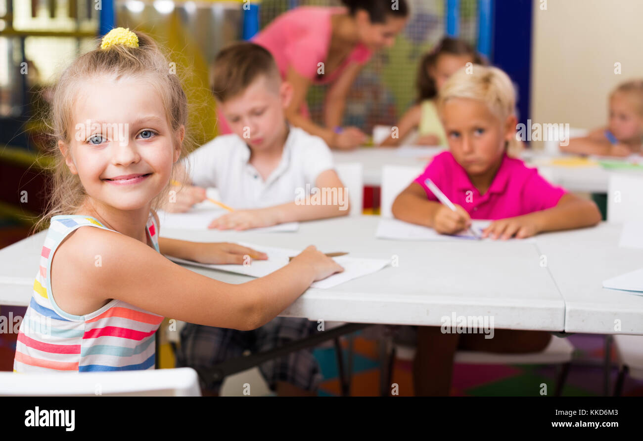 Smiling schoolgirl in elementary school age in class indoors Stock ...