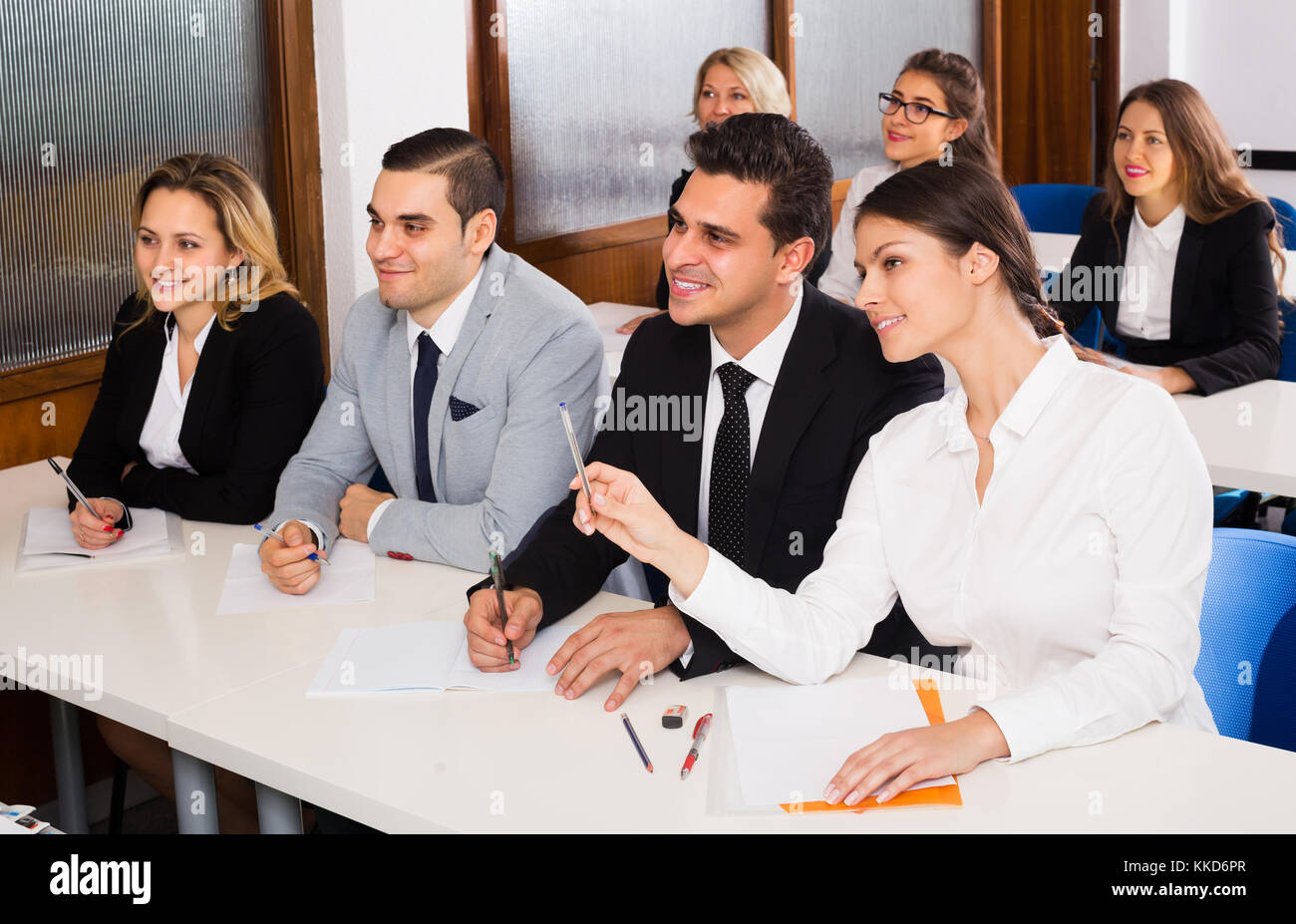Professor and positive professionals at extension business courses ...