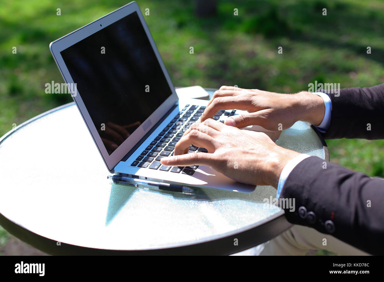 Freelancer doing online work on laptop Stock Photo - Alamy