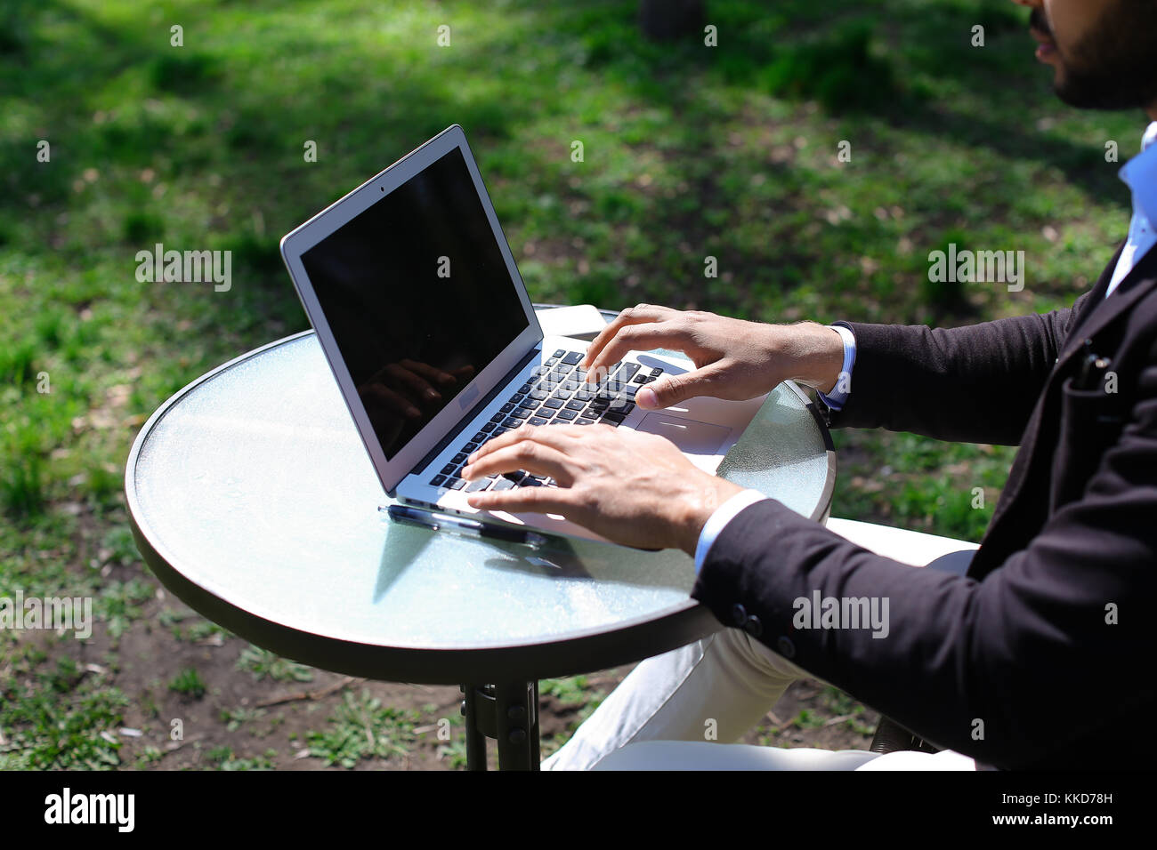 Freelancer doing online work on laptop Stock Photo - Alamy