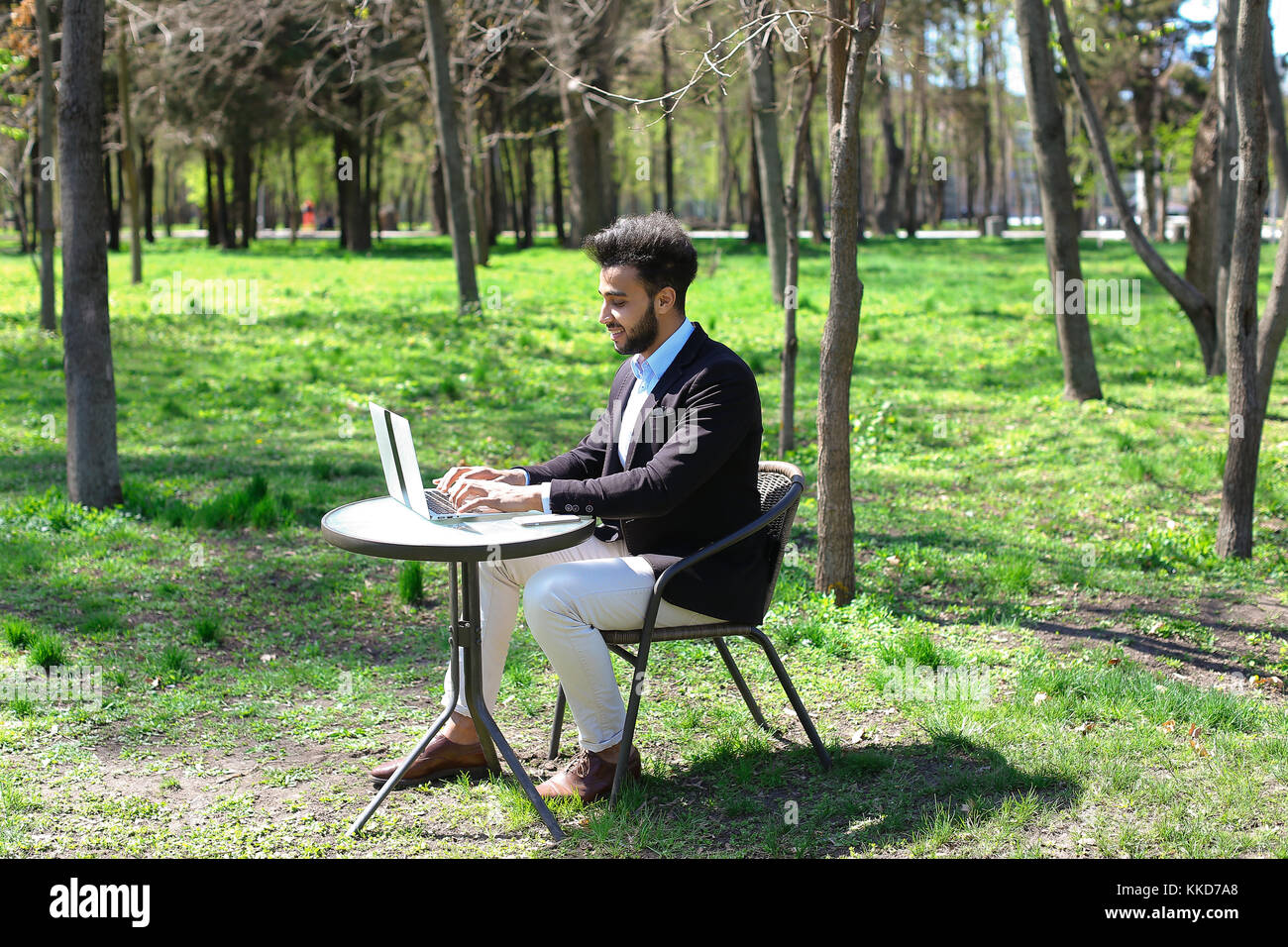 Journalist finished work in park Stock Photo - Alamy