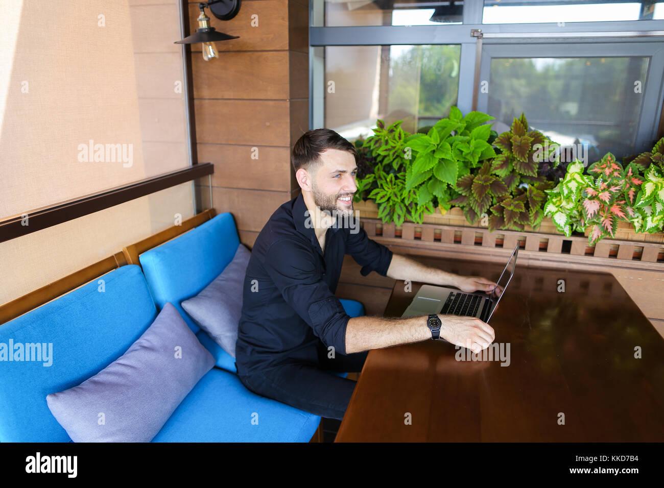 European manager giving interview and looking at camera near lap Stock ...