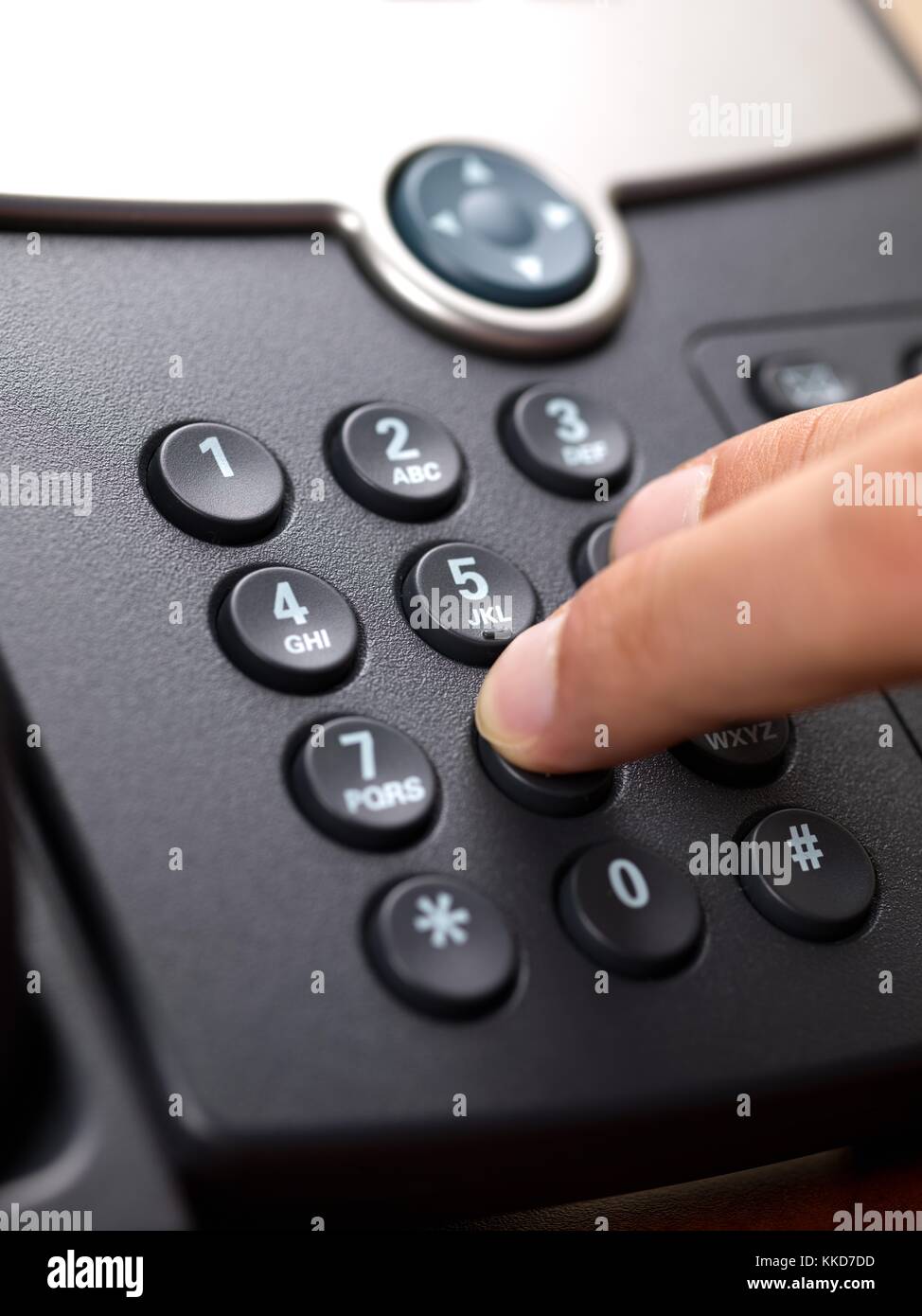 close up shot of fingers pressing numbers on landline phone Stock Photo ...