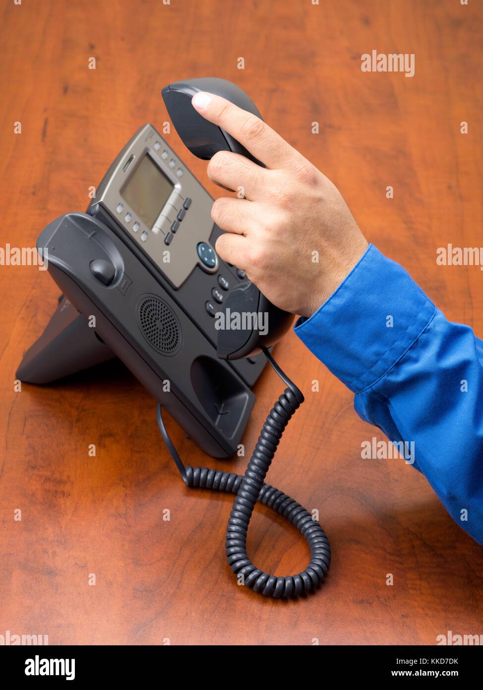 close up shot of human hand holding landline phone receiver Stock Photo ...