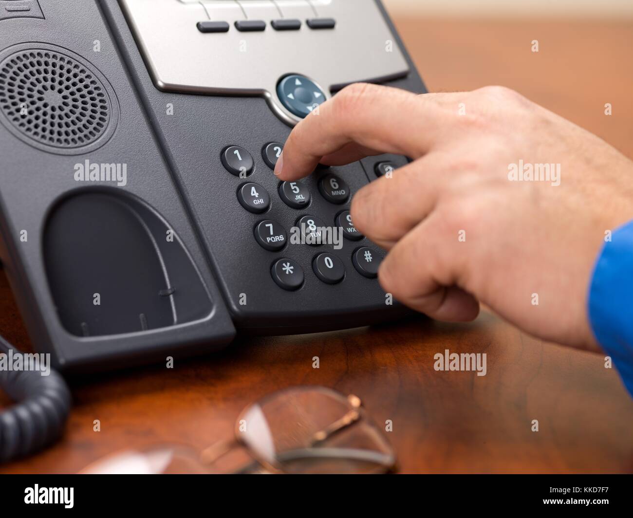 cropped image of human hand dialing number on landline Stock Photo - Alamy