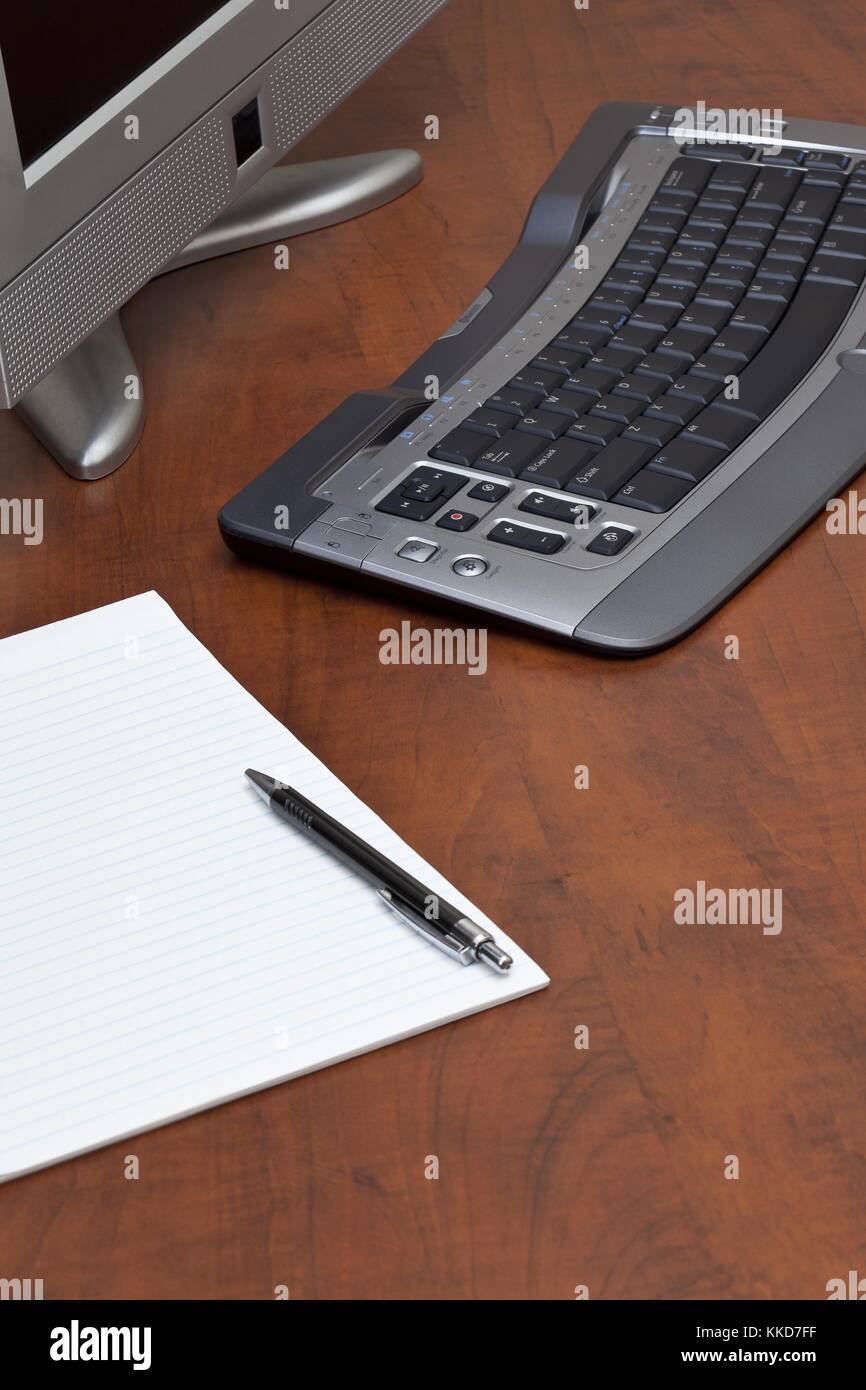 desktop computer with pen and paper Stock Photo - Alamy