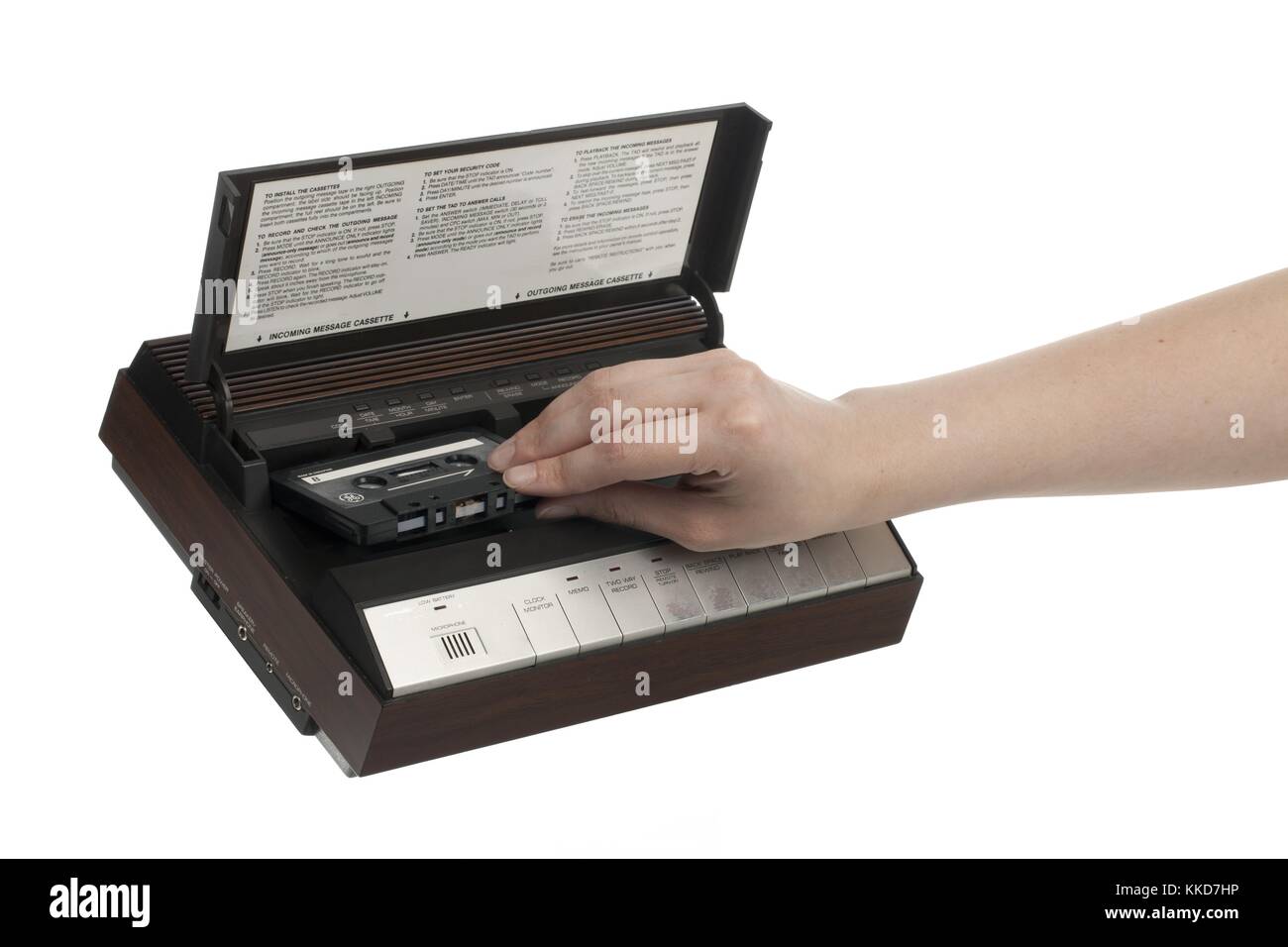hand inserting cassette in an answering machine Stock Photo - Alamy