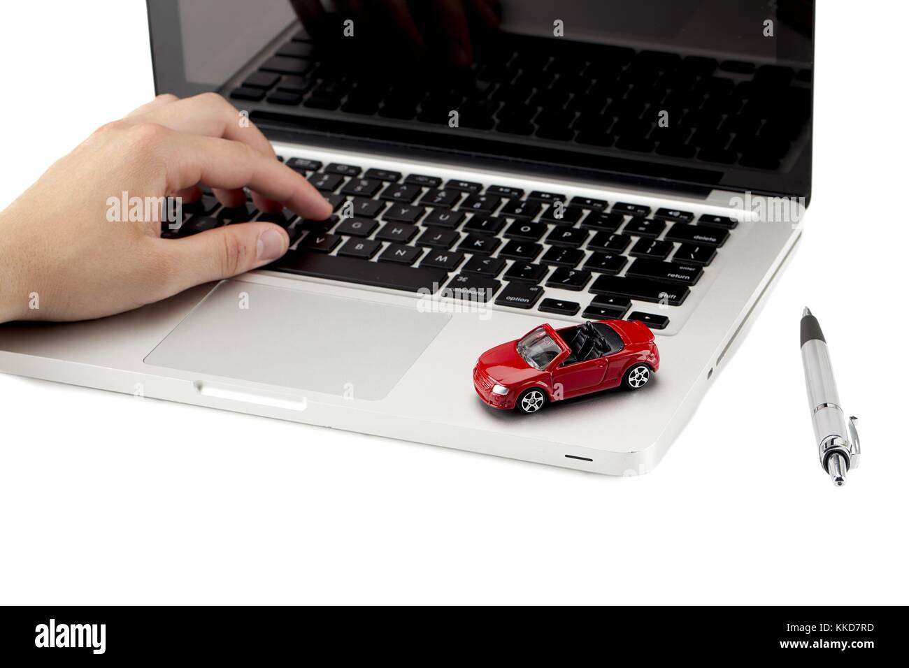 red toy car on laptop Stock Photo - Alamy