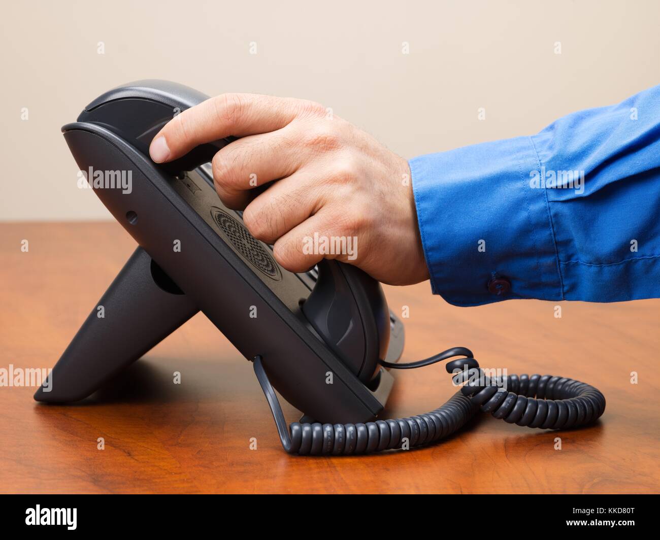 close up image of a person holding telephone reciever Stock Photo - Alamy