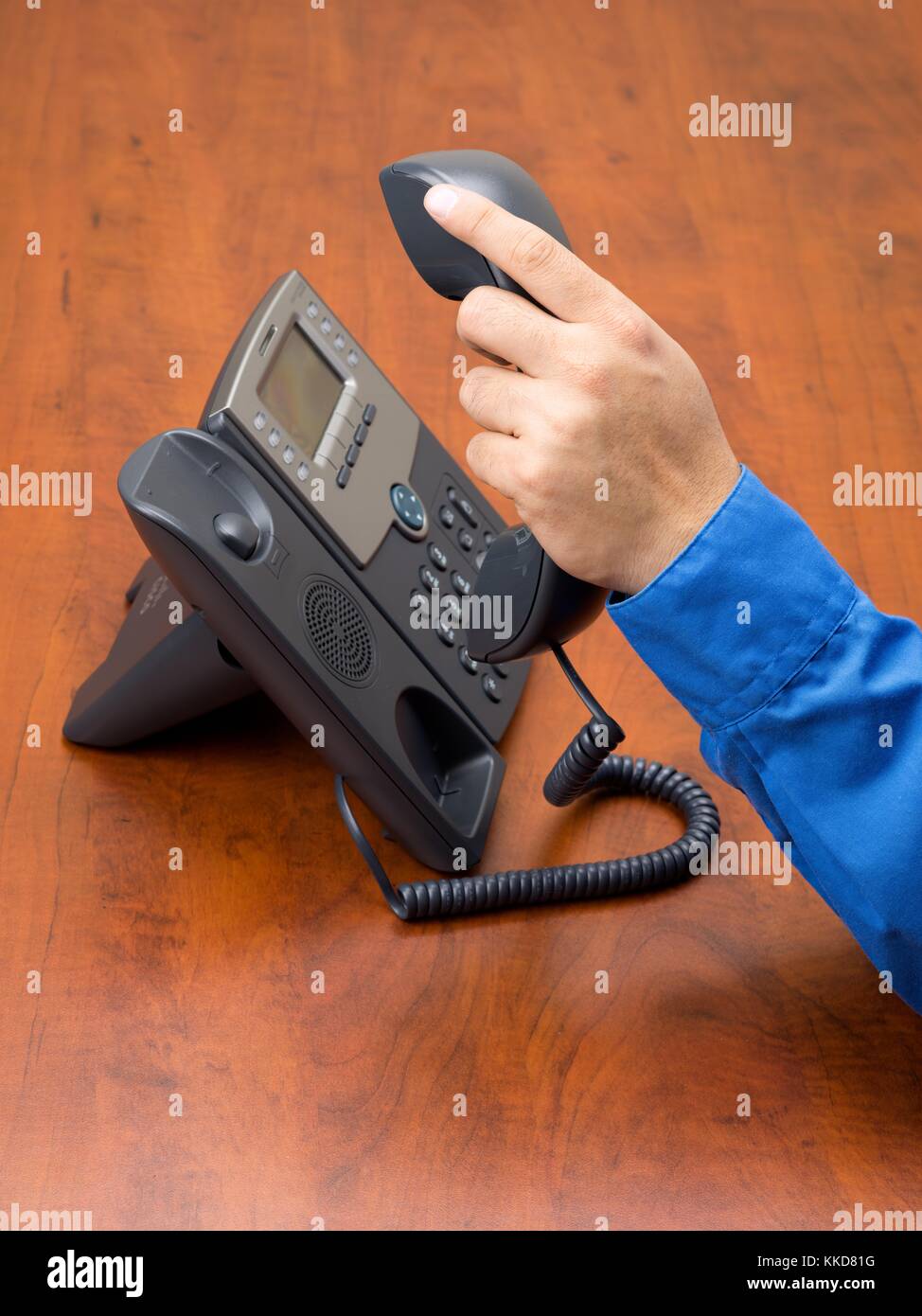 close up of human hand holding telephone receiver Stock Photo - Alamy