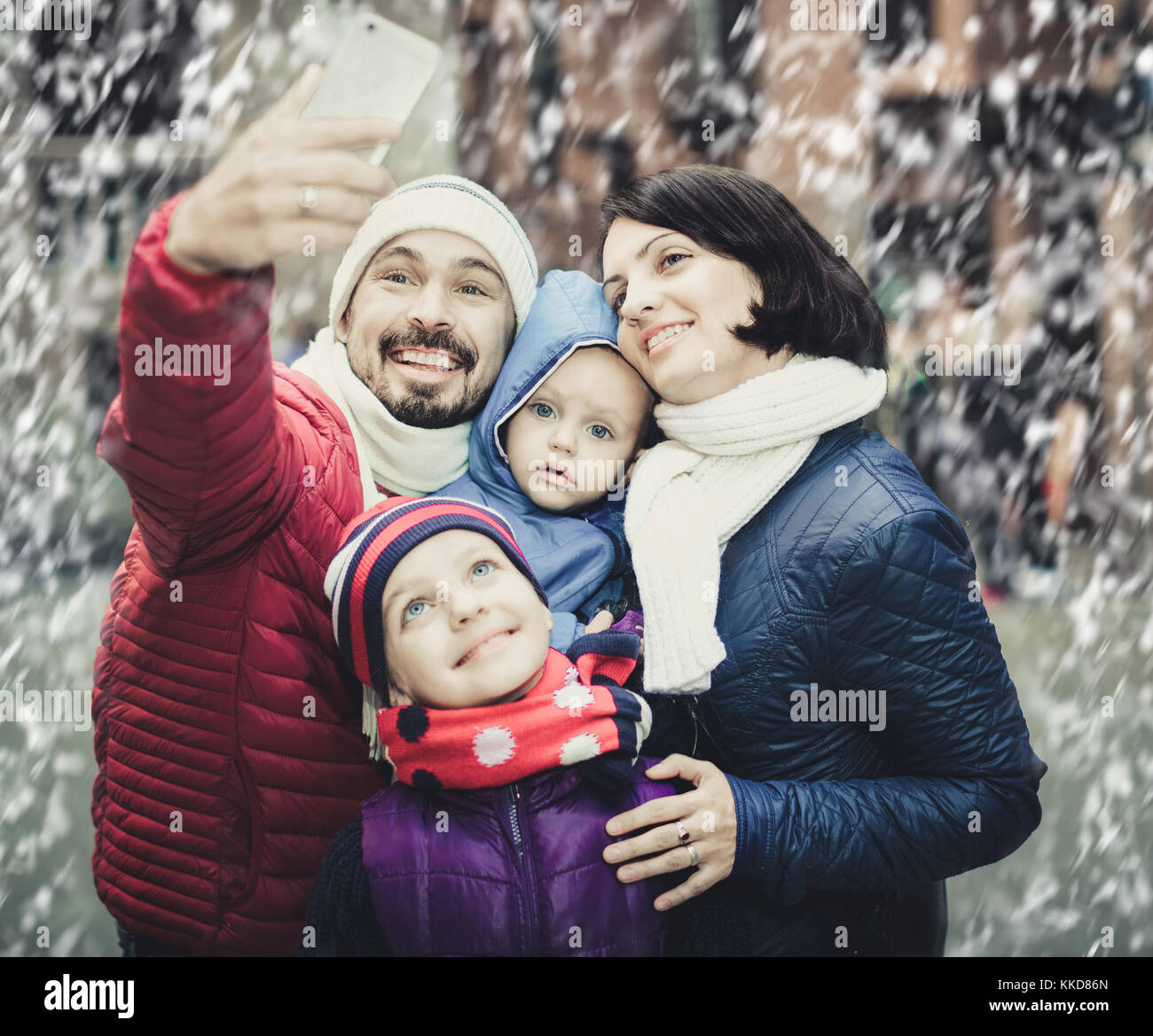 Dad and mom with their children making selfie together Stock Photo - Alamy