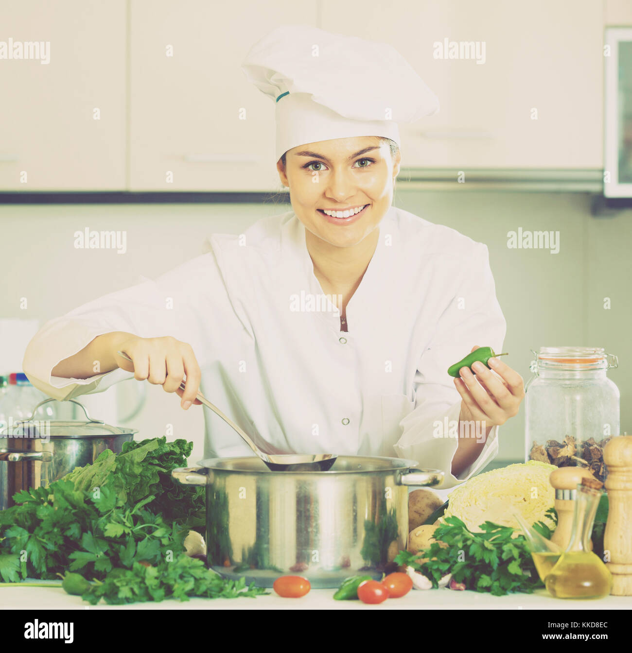 female cook preparing vegetarian meal at home Stock Photo - Alamy