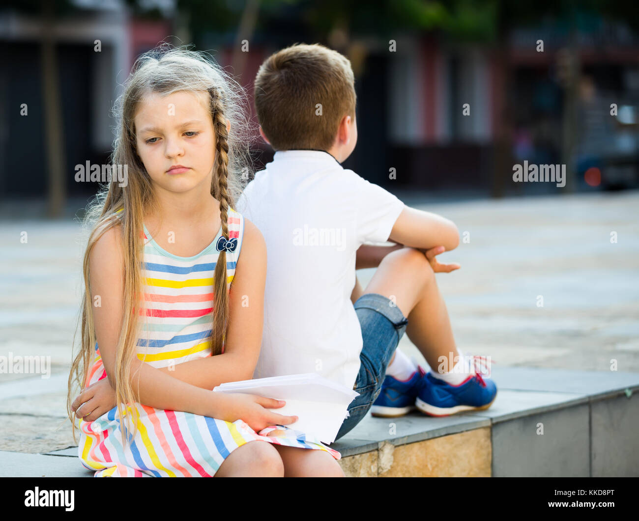 sad girl in preschool age having problem with friend outdoors in park ...