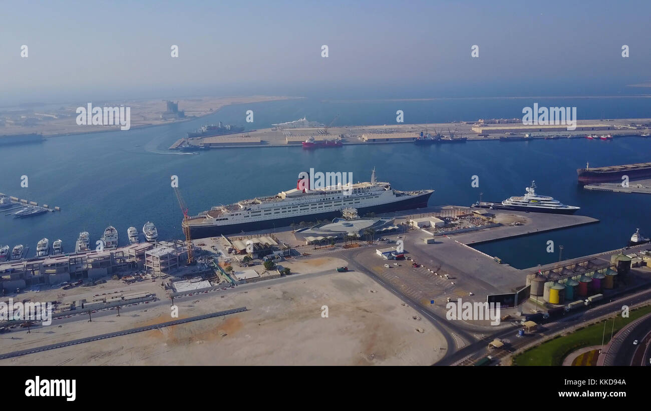 Huge cruise ship is on the water. Aerial view of Dubai seaport United ...