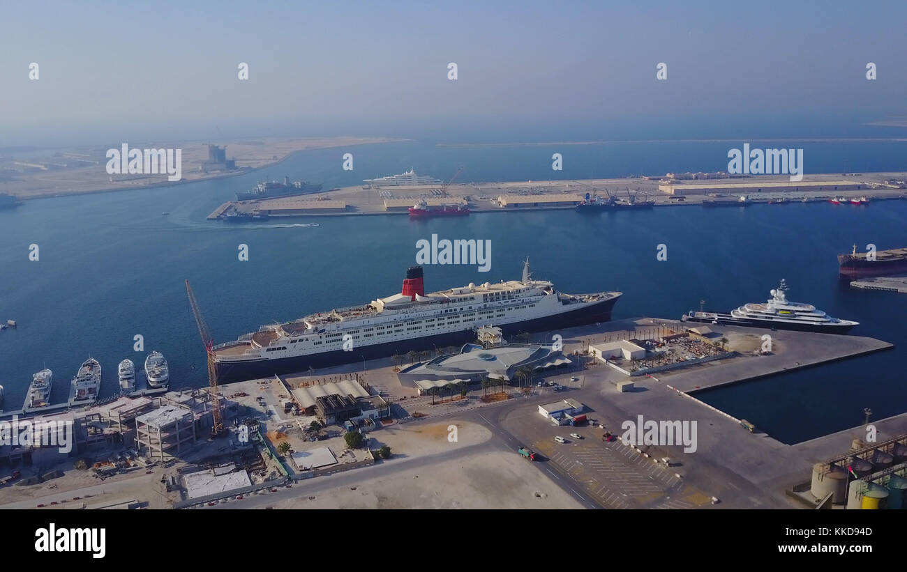 Huge cruise ship is on the water. Aerial view of Dubai seaport United ...