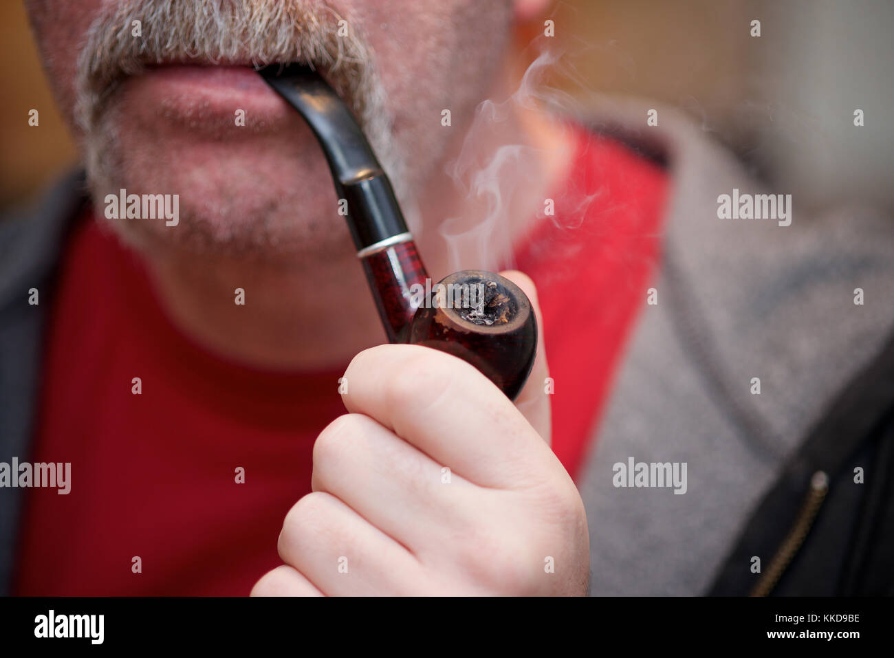 Close up of a man with a handlebar moustache and a pipe Stock Photo - Alamy
