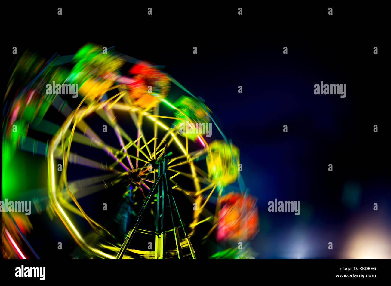 ferris wheel with neon light moving spin at night carnival park Stock ...