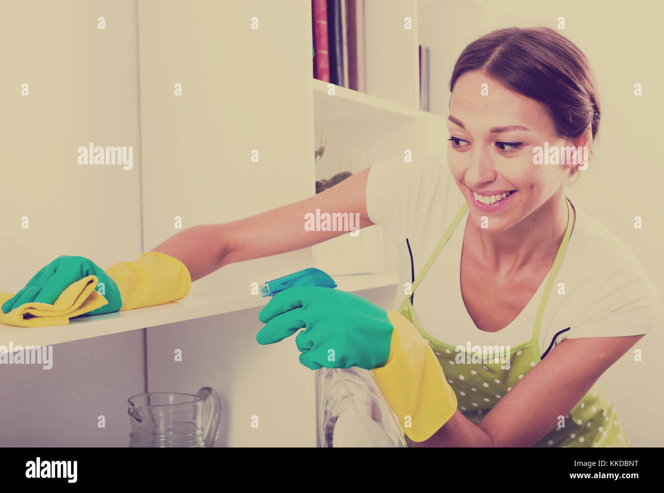 glad woman housewife cleaning using duster at home indoors Stock Photo ...