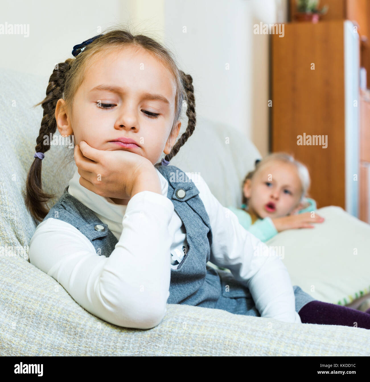 Portrait of two little miserable girls having conflict at home Stock ...