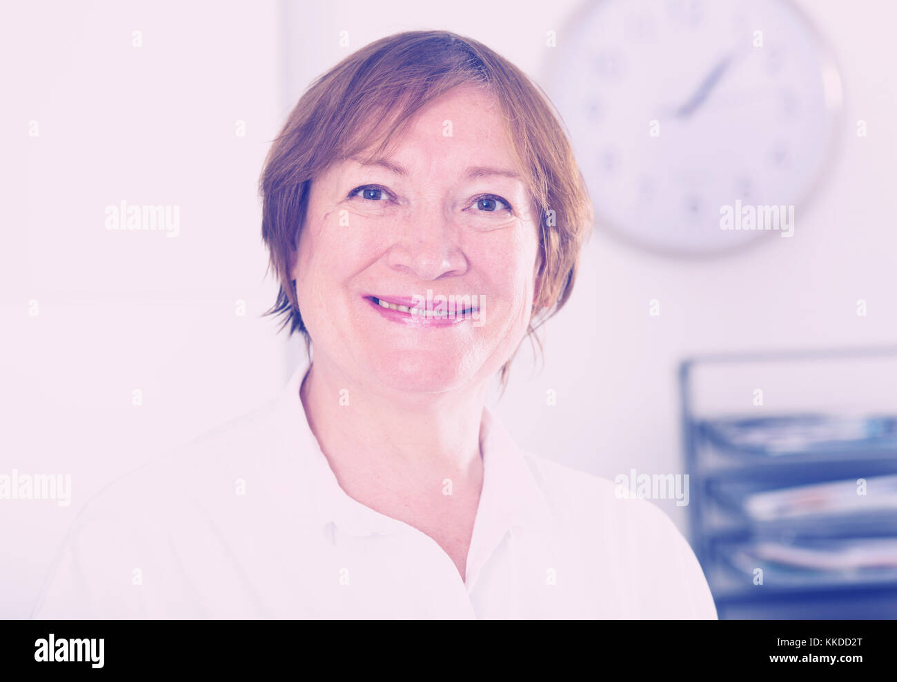 Smiling woman worker working effectively on project in office Stock ...