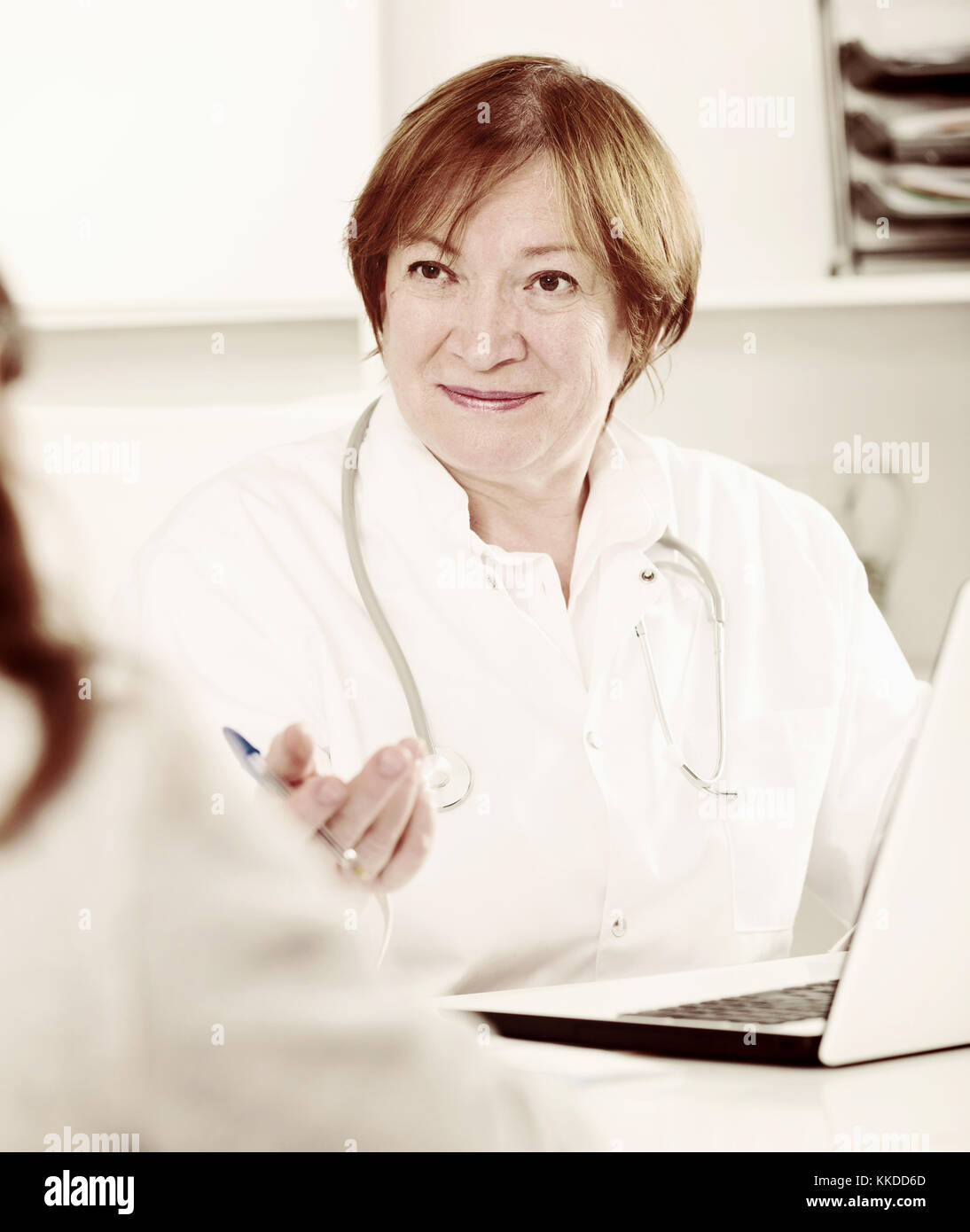 Young female client visiting consultation with woman doctor in hospital ...