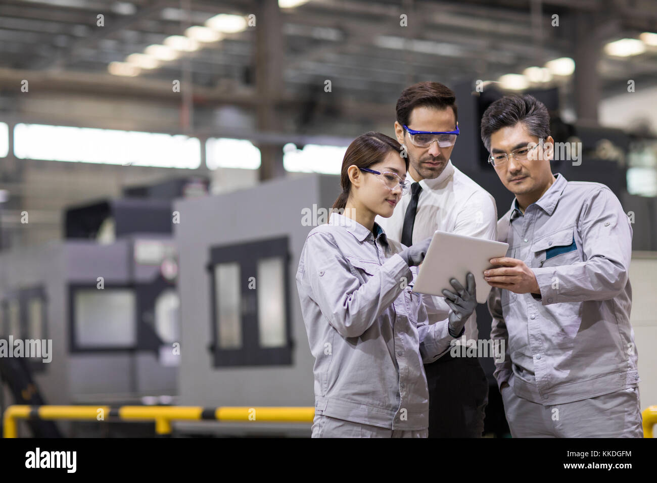Businessman and engineers talking in the factory Stock Photo - Alamy