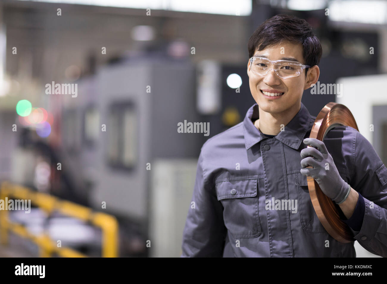 Confident Chinese engineer in the factory Stock Photo - Alamy