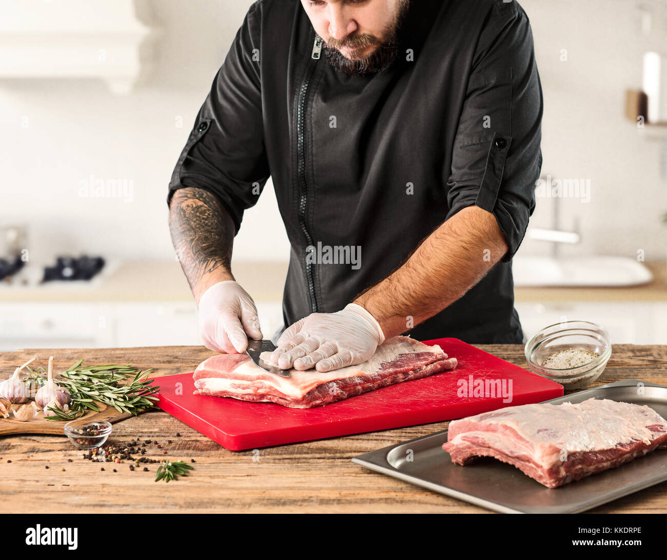 Man cooking meat steak on kitchen Stock Photo - Alamy