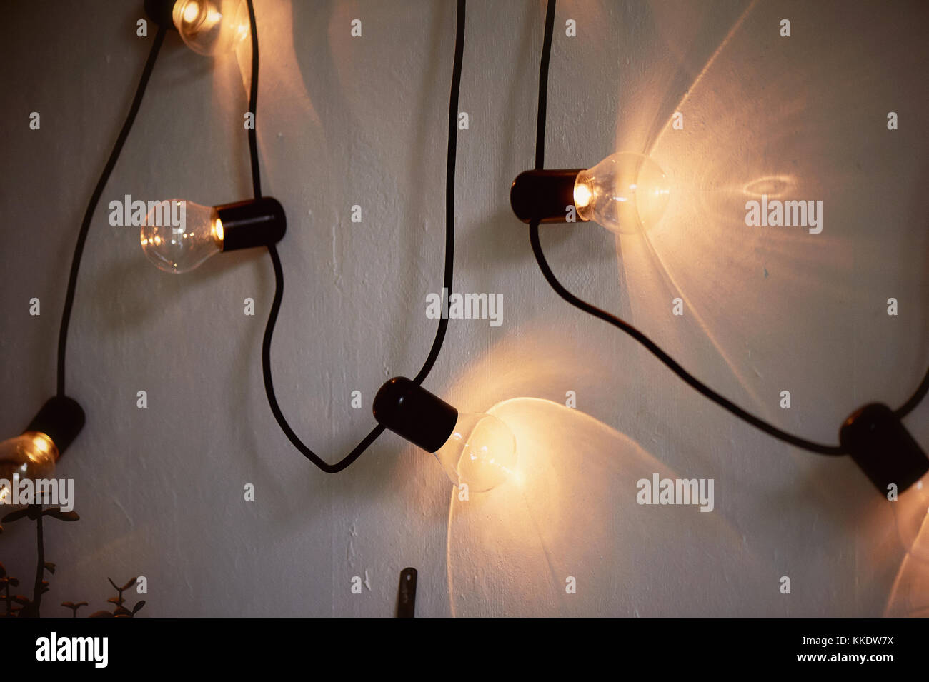 Edison light bulb hanging on a long wire. Cozy warm yellow light.Retro ...