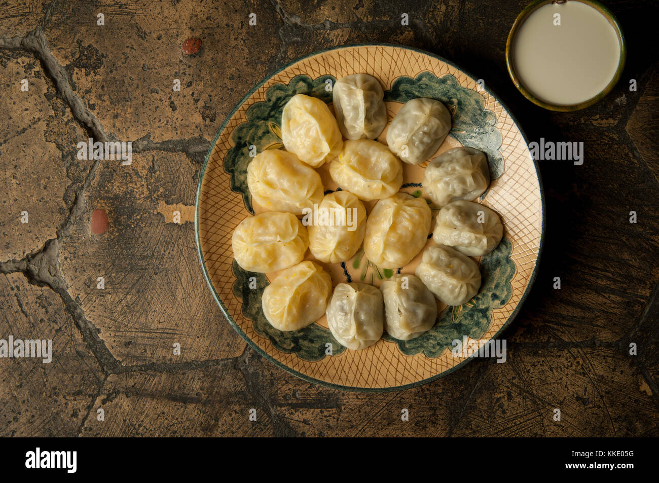 oriental dishes on decorative old tiles. meat in a test on a decorative ...