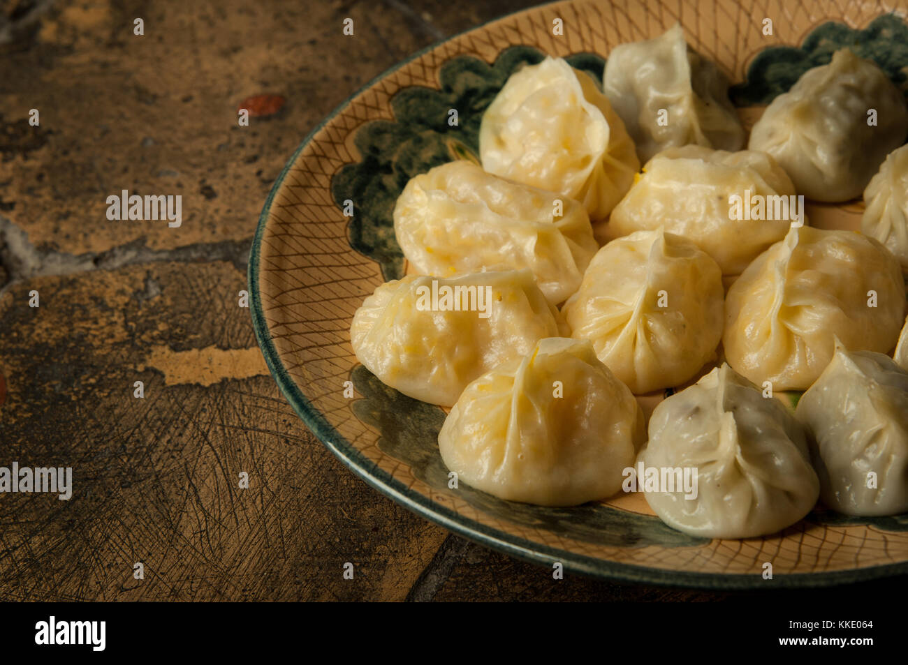 oriental dishes on decorative old tiles. meat in a test on a decorative ...