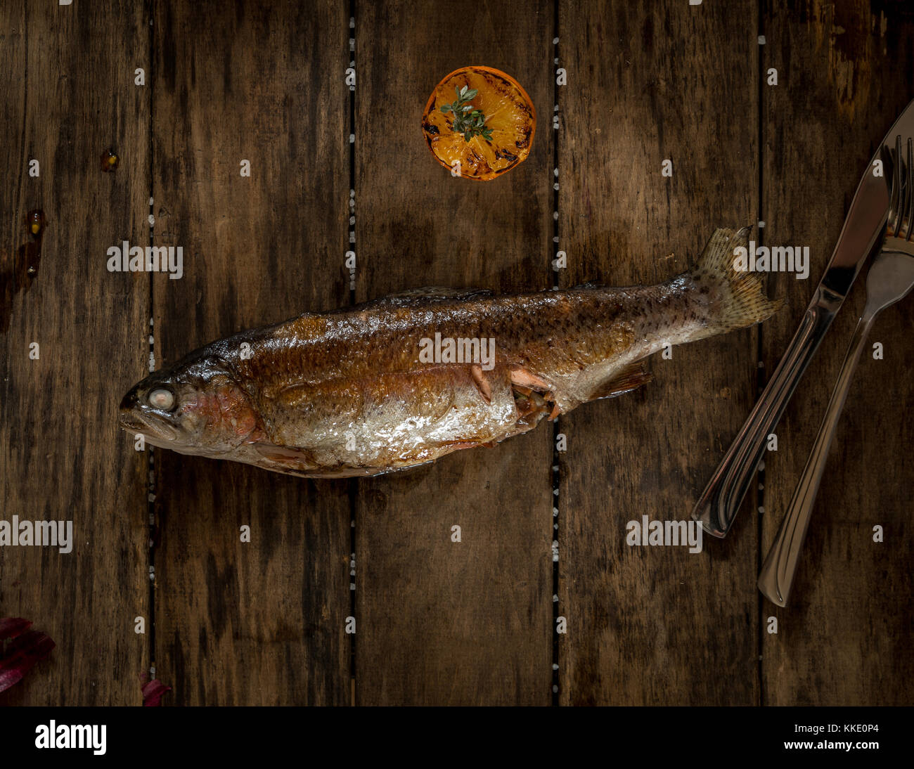 baked fish on wooden boards, top view Stock Photo - Alamy
