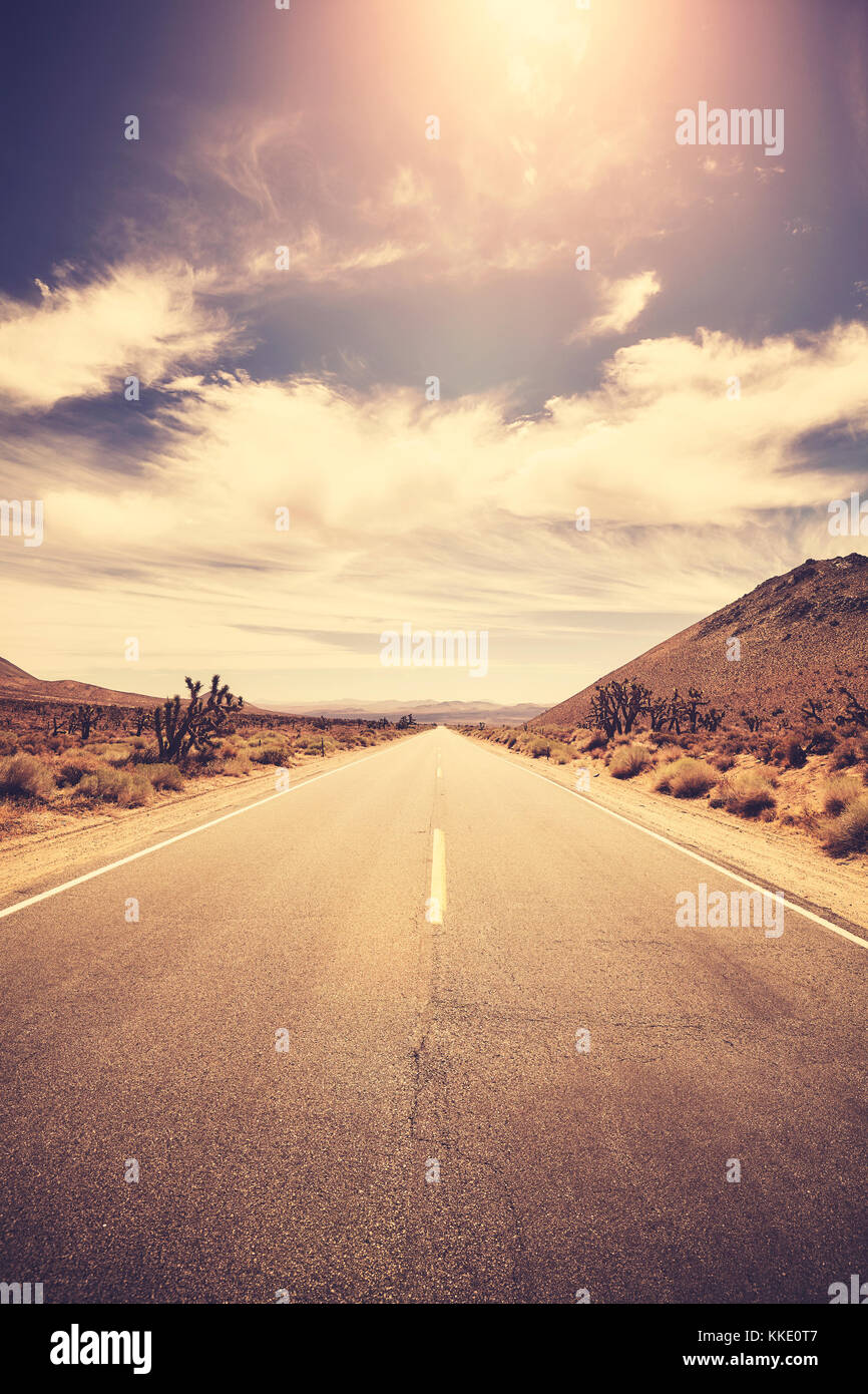 Vintage stylized picture of a road at sunset, travel concept, USA Stock ...