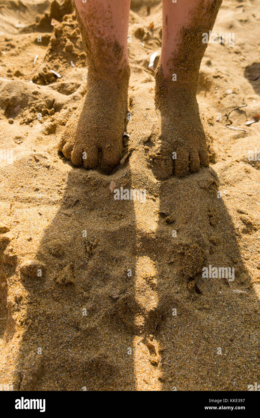 Kid beach buried hi-res stock photography and images - Alamy