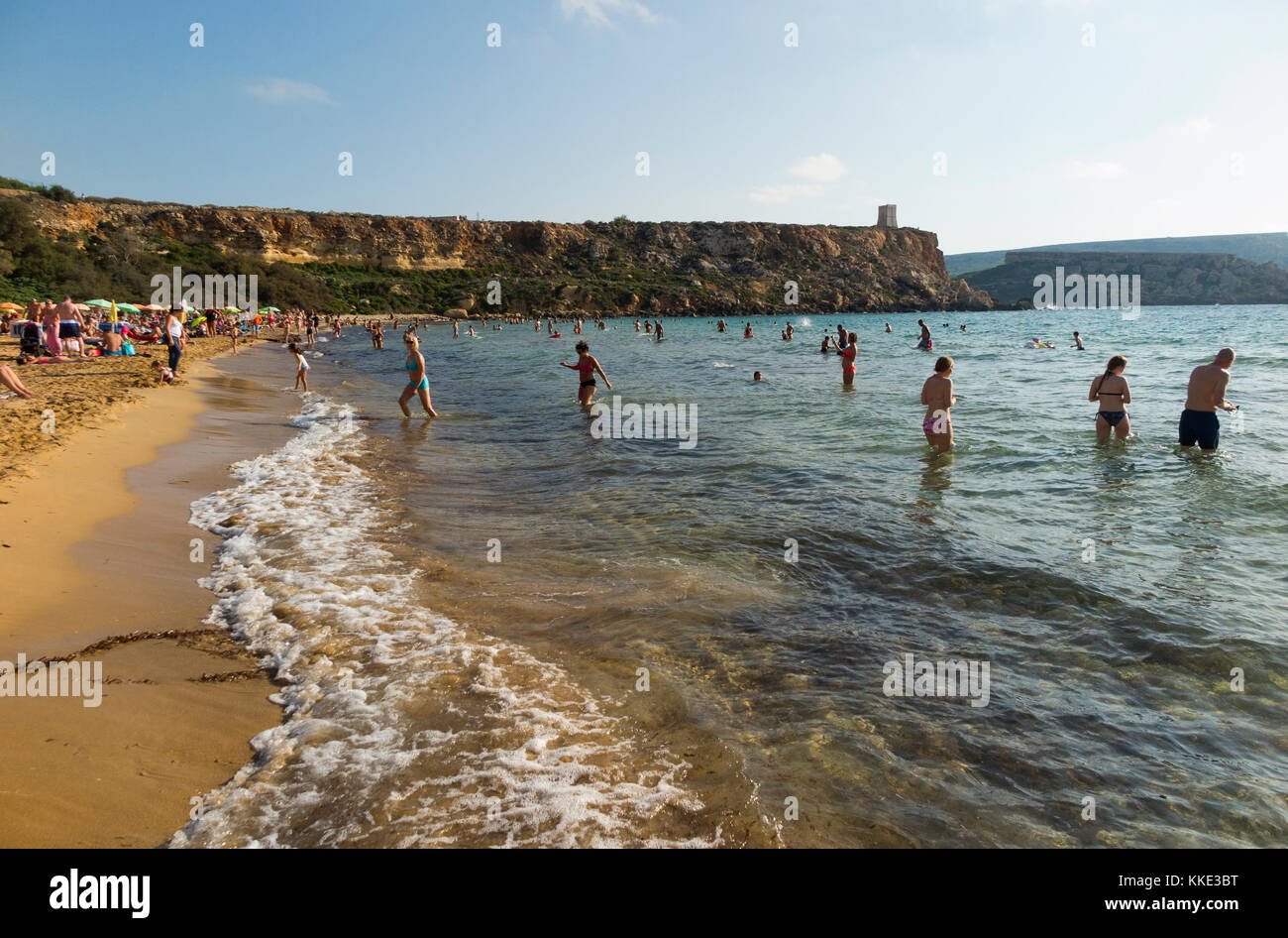 Sea and sandy beach with tourists / sunbathers people enjoying ...